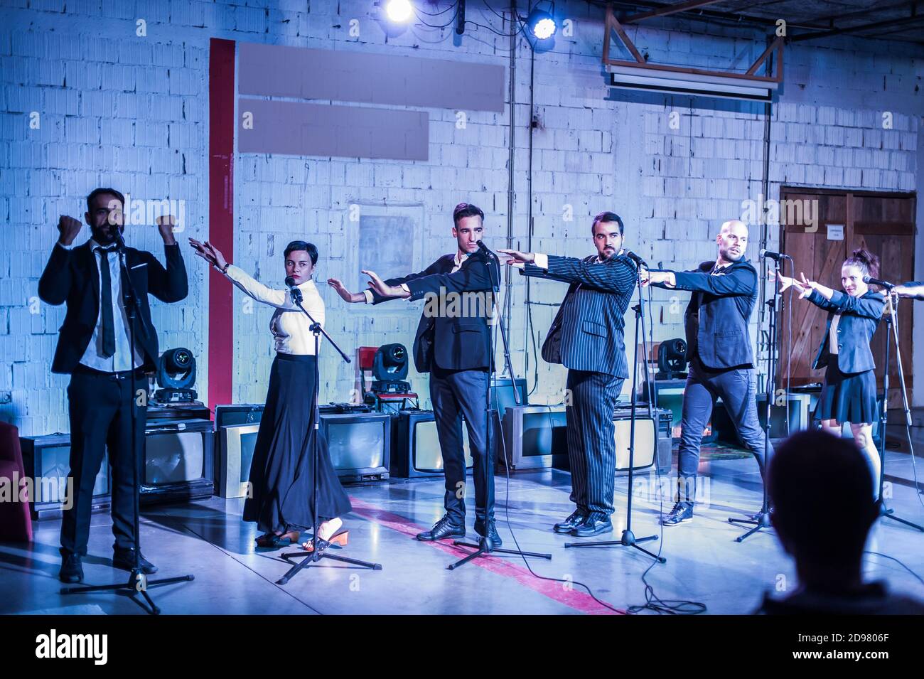 Large group of theater actor artists on stage perform play for audience ...