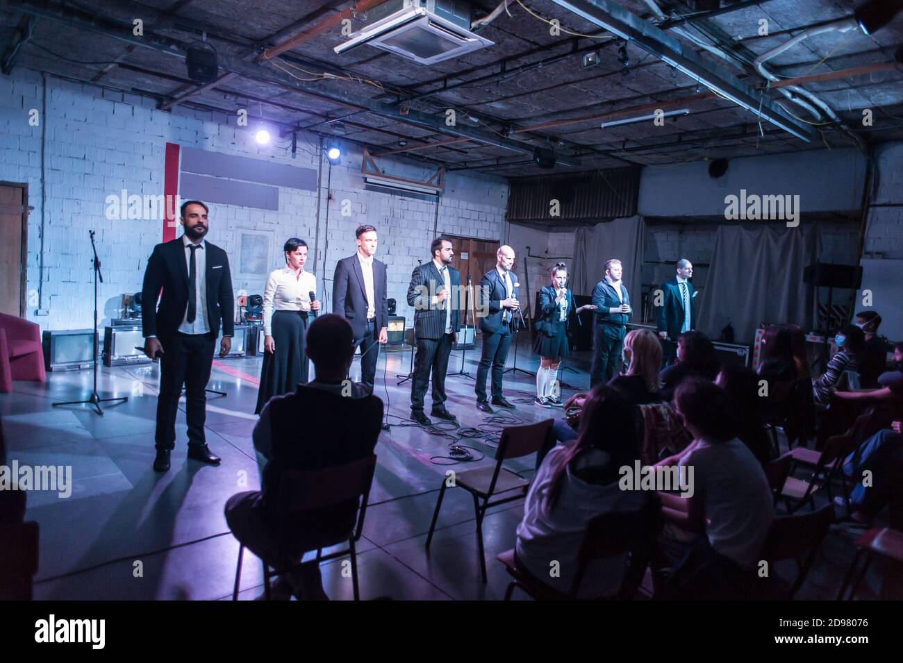 Large group of theater actor artists on stage perform play for audience ...