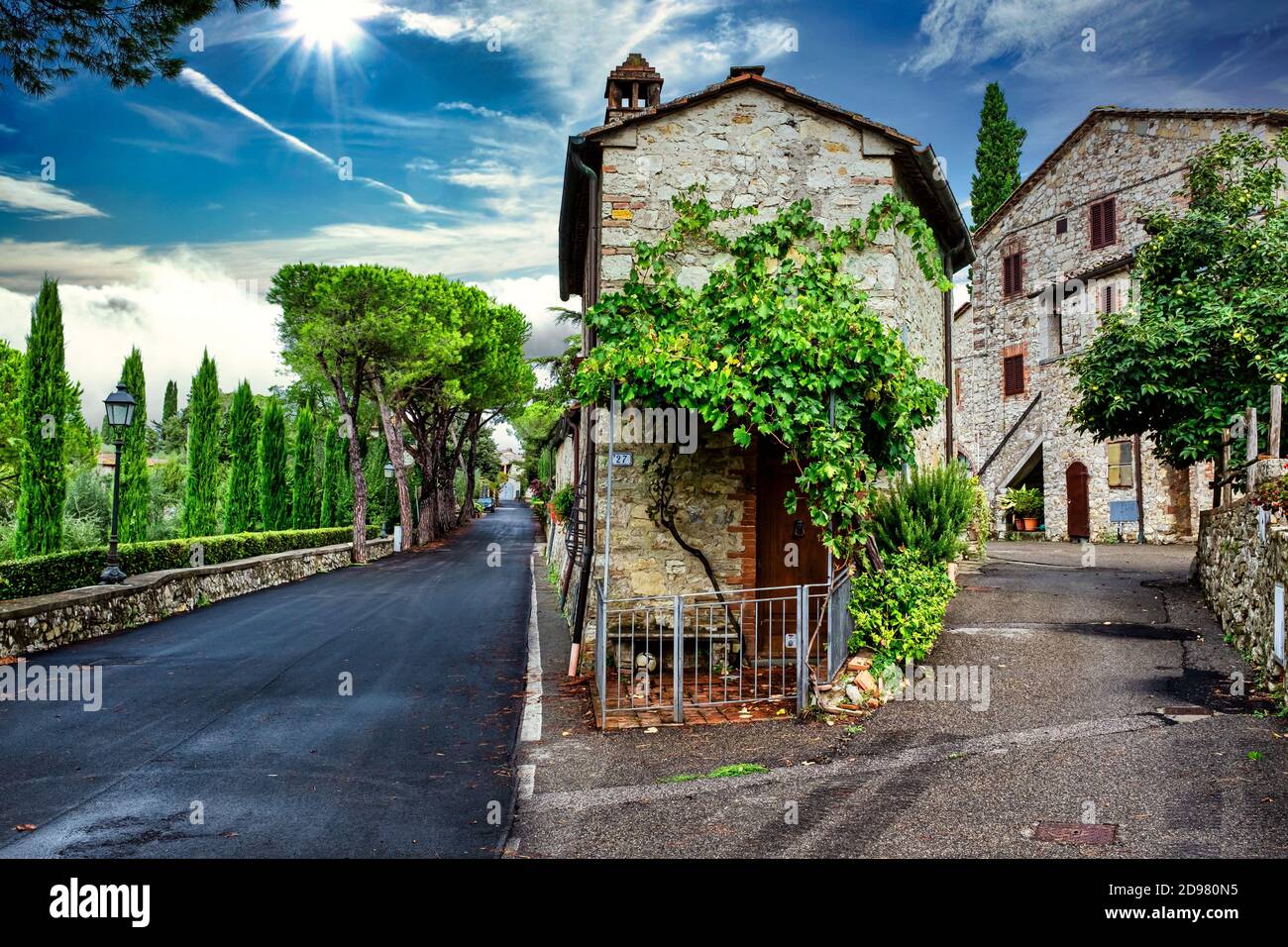 Picturesque village houses and road with vivid summer sky in San Sano ...
