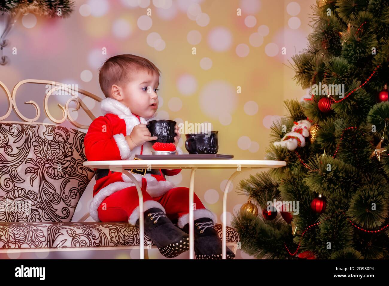 Little boy drinking tea hi-res stock photography and images - Alamy