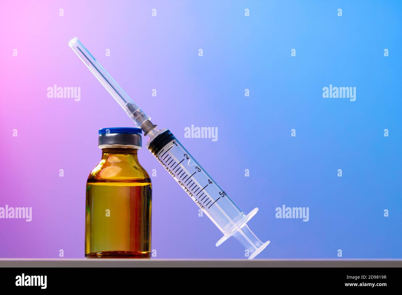 Medical vial with medication and syringe close up Stock Photo - Alamy