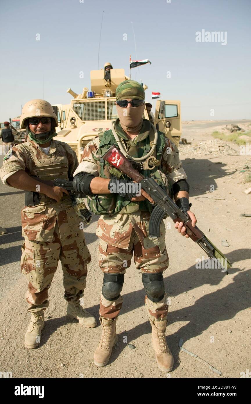 Members of the Iraqi National Gaurd patroling the roads near Basra ...