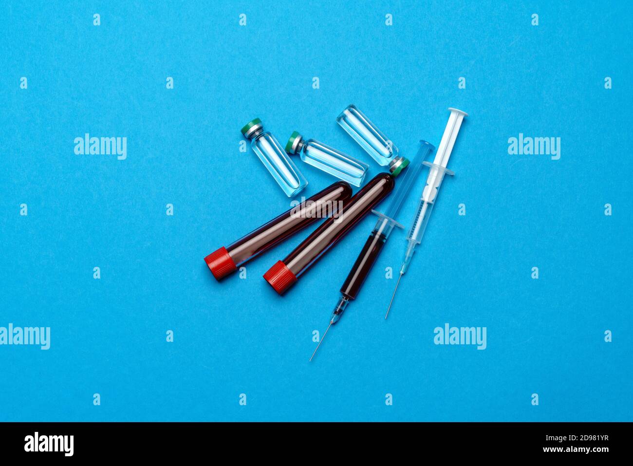 Syringe, test tubes with blood samples and ampoules with medicines or ...