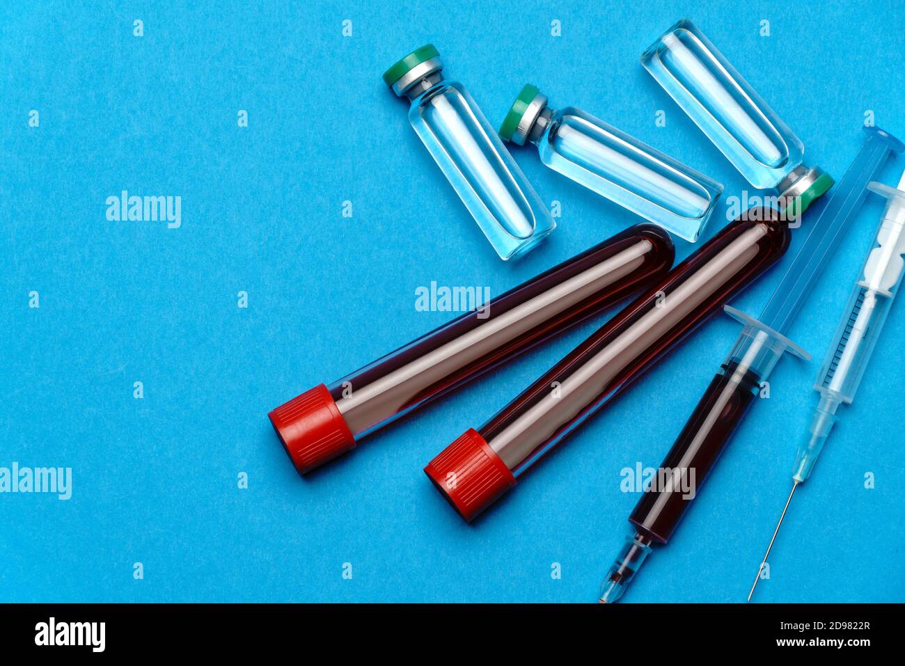 Syringe, test tubes with blood samples and ampoules with medicines or ...