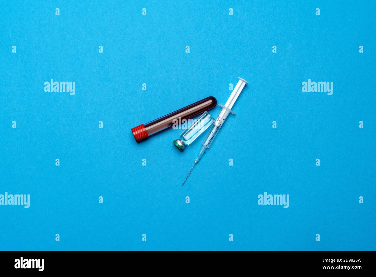 Syringe, test tubes with blood samples and ampoules with medicines or ...