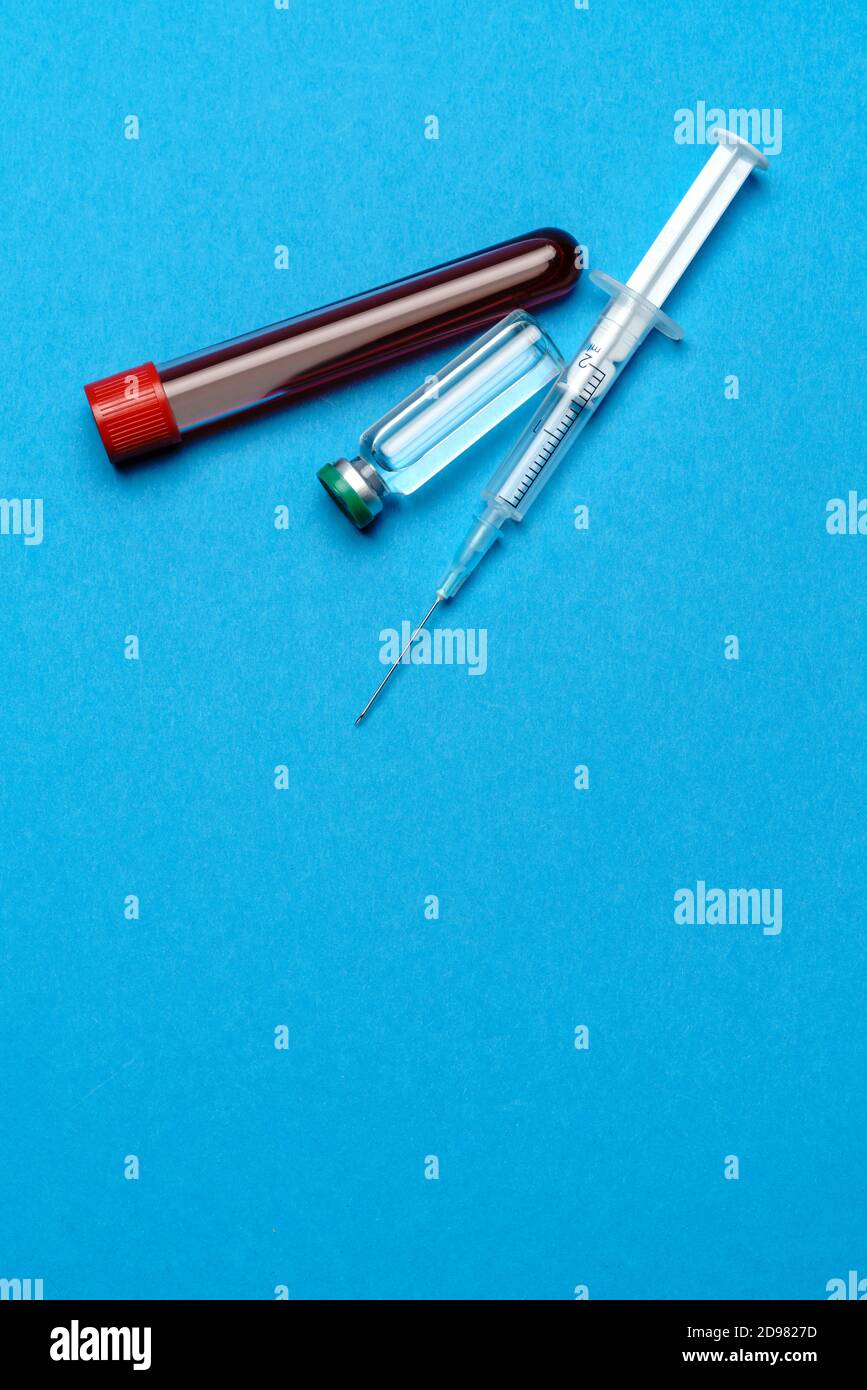 Syringe, test tubes with blood samples and ampoules with medicines or ...