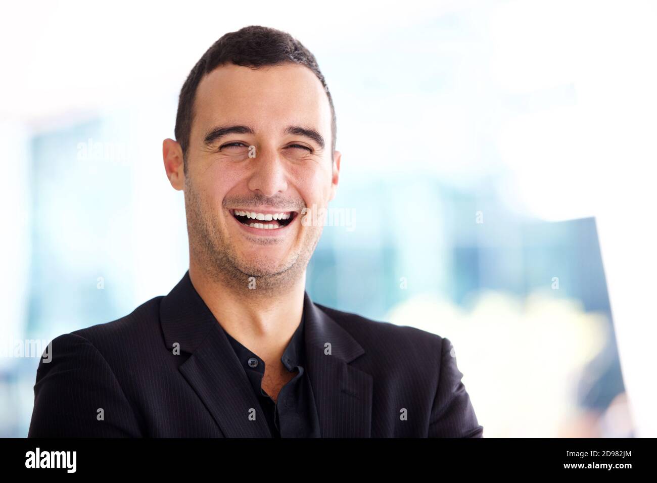 Close up portrait of happy businessman laughing Stock Photo - Alamy