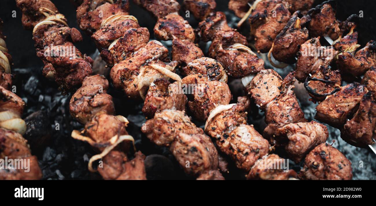 Shashlik cooking concept. Close-up of grilling tasty dish on barbecue ...