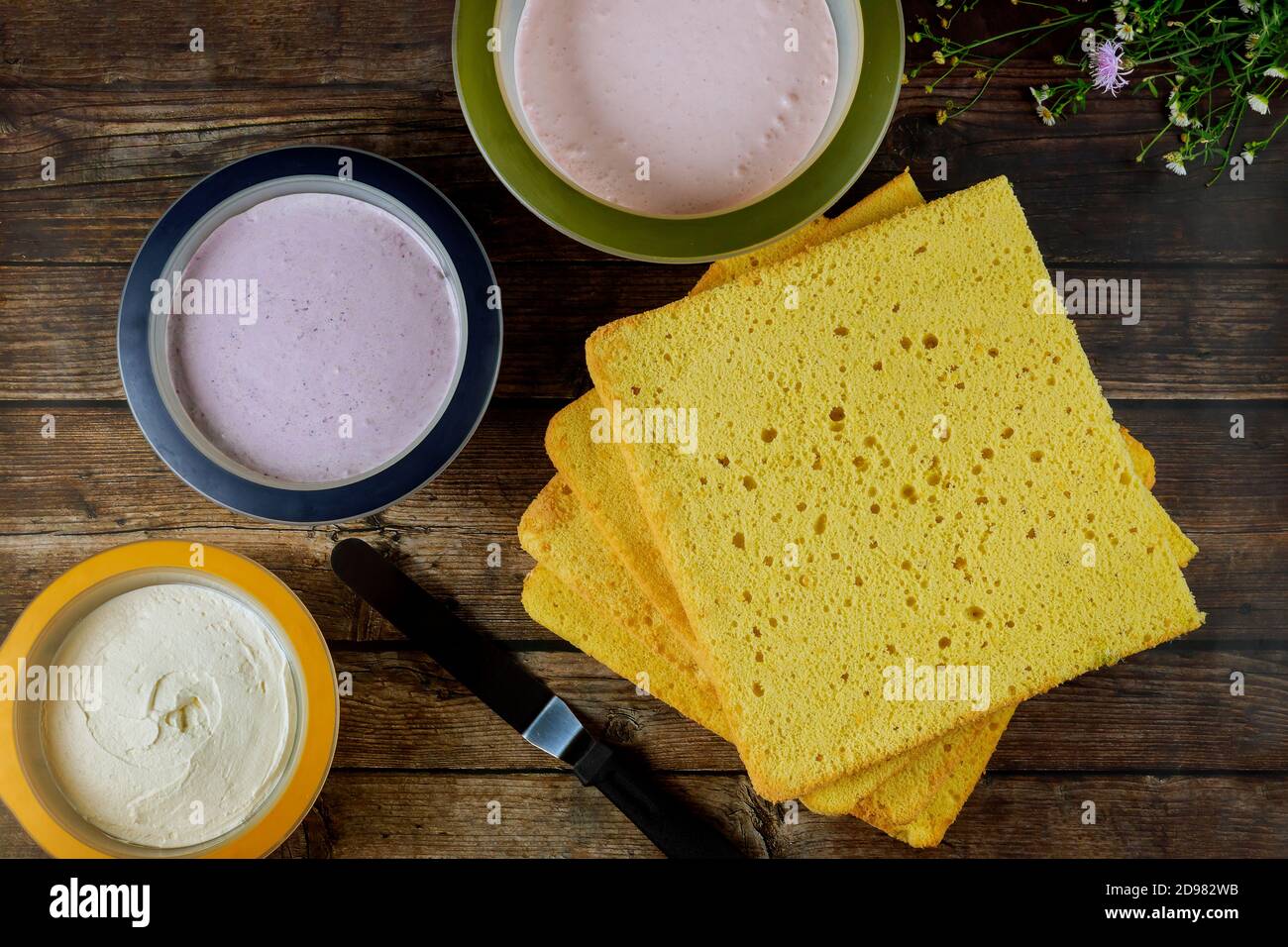 Homemade icing and cut cake for making festive cake. Baker occupation ...