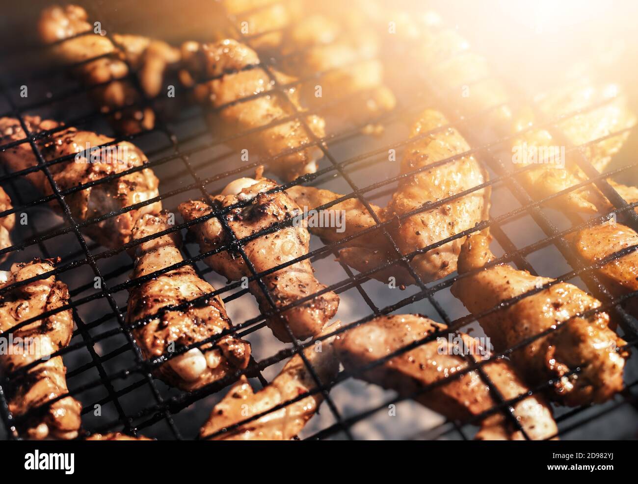 Tasty food concept. Chicken wings on barbecue grill Stock Photo - Alamy