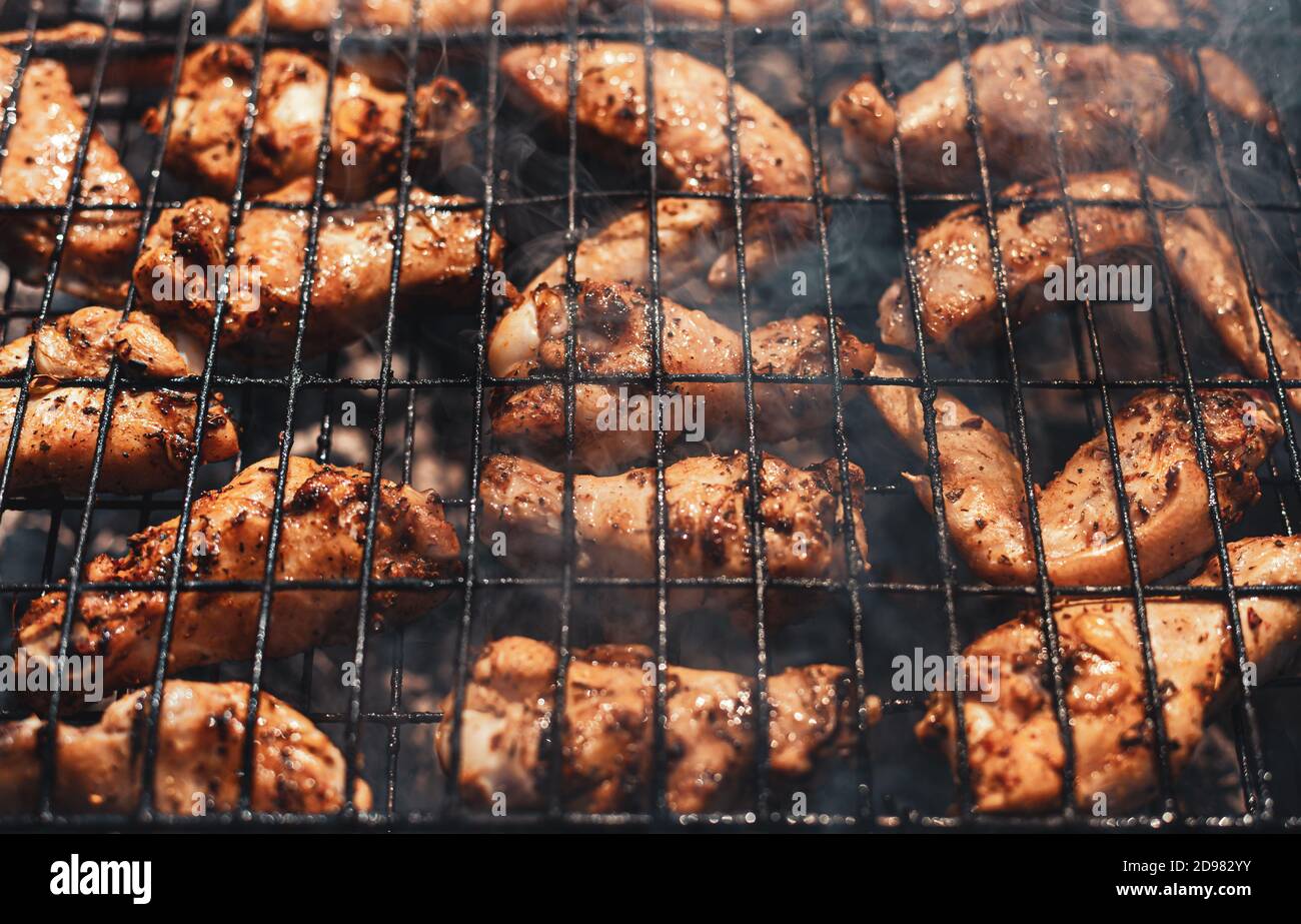 Tasty food concept. Chicken wings on barbecue grill Stock Photo - Alamy
