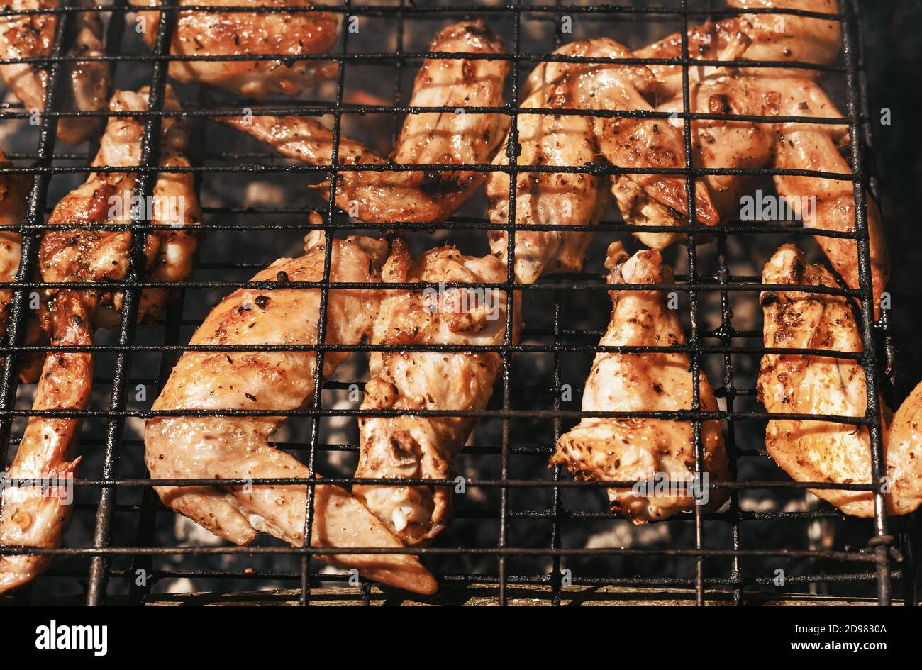 Tasty food concept. Chicken wings on barbecue grill Stock Photo - Alamy