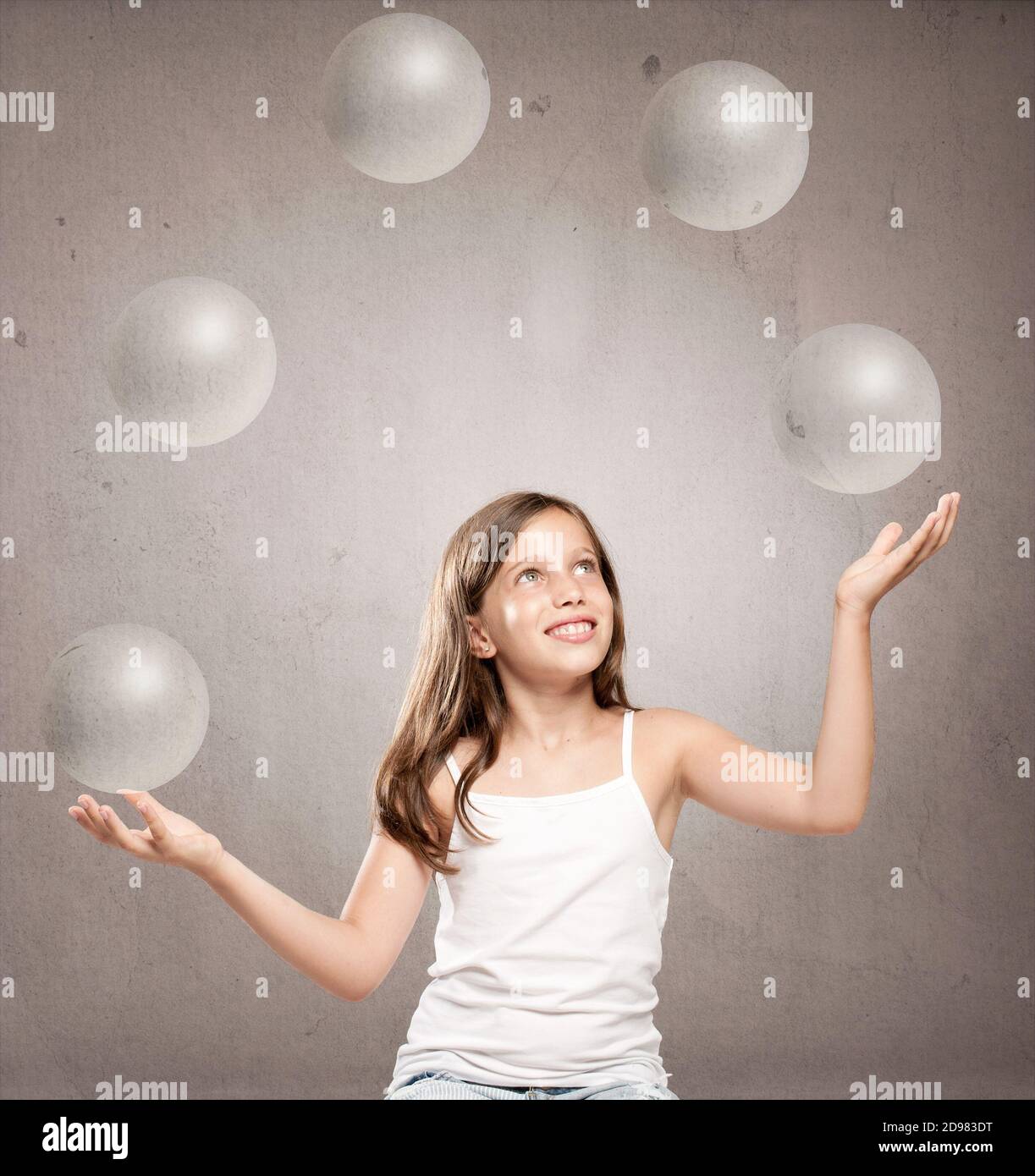 little girl juggling with crystal sphere balls Stock Photo - Alamy