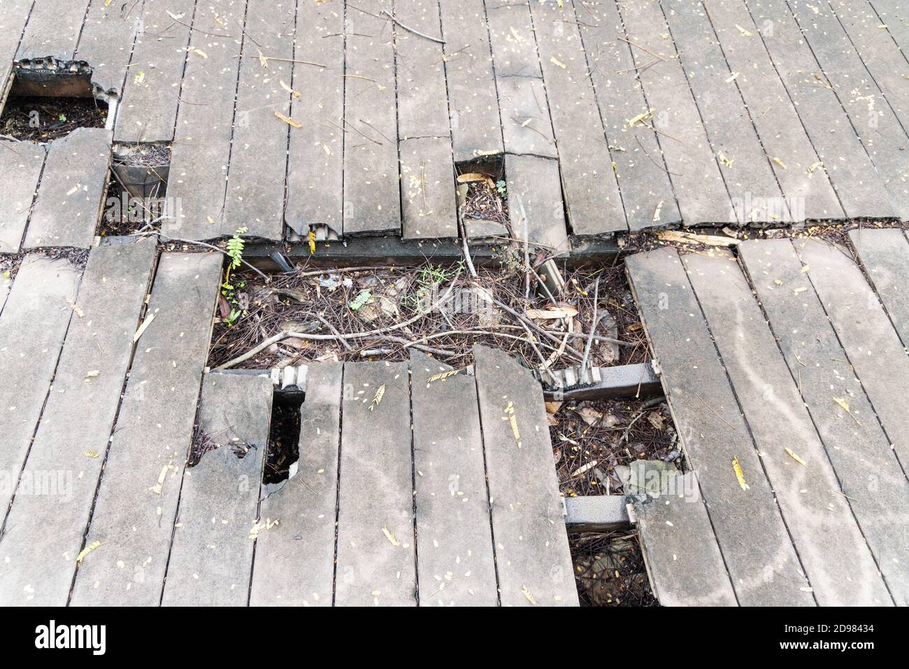 Broken outdoor hardwood floor due to lack of maintenance Stock Photo ...