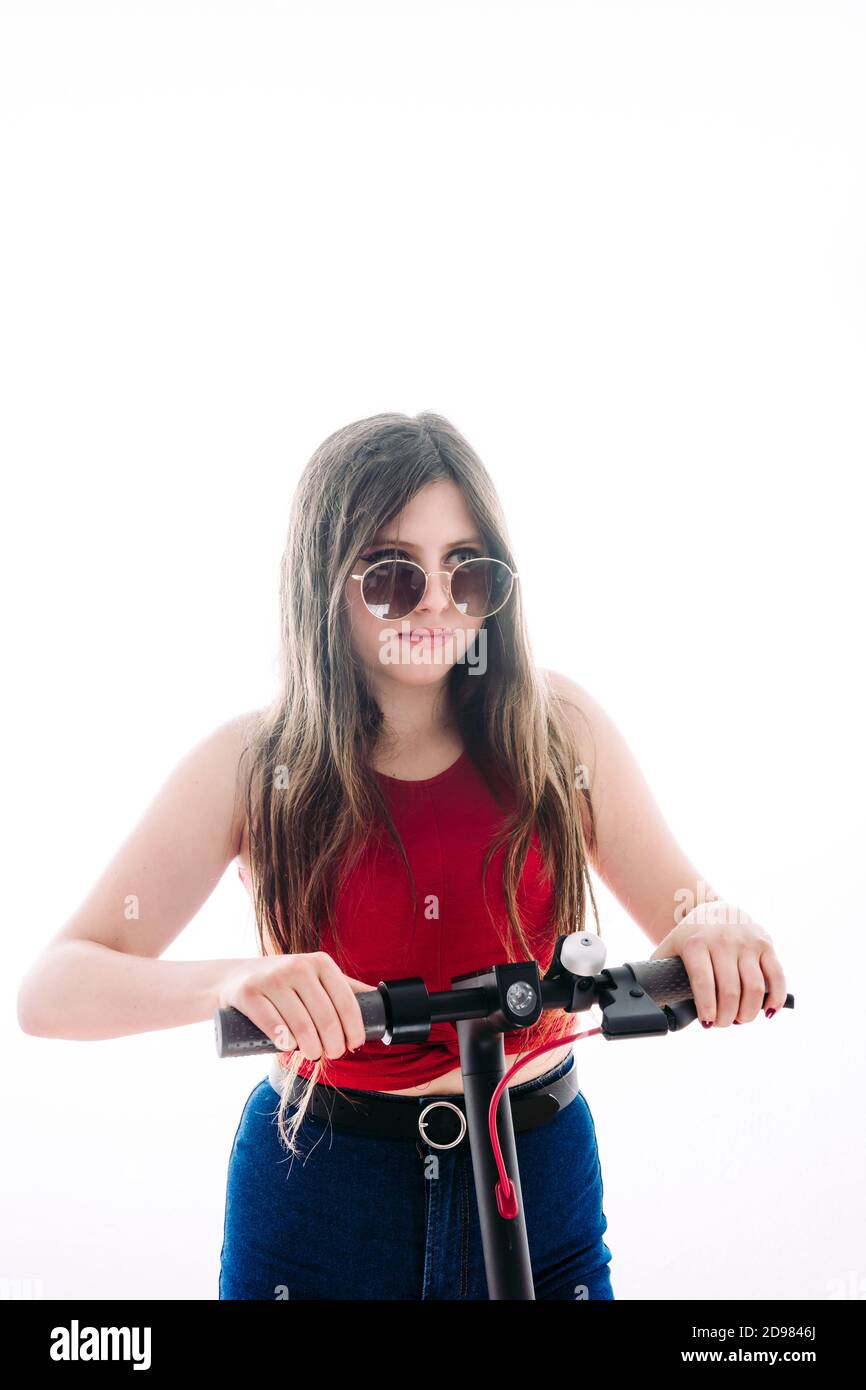 Girl driving an electric scooter with a speed face. Photography with ...