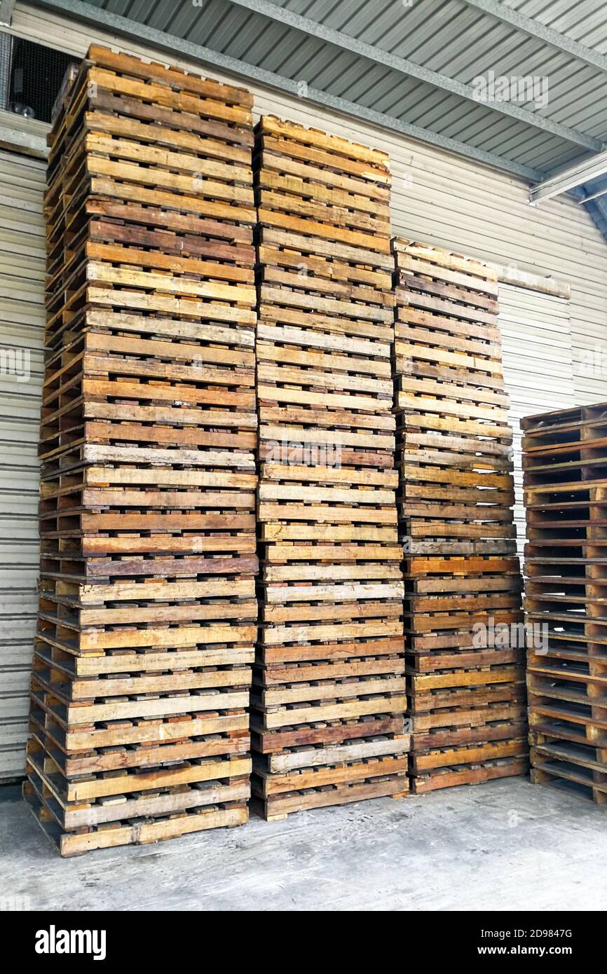 Stack of wooden pallets at warehouse. Transportation logistic business ...