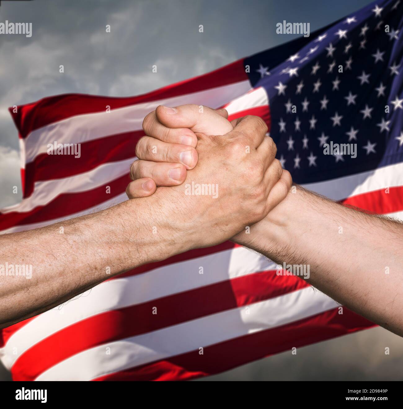 Patriotic concept. Handshaking. The USA flag and shaking hands of two ...