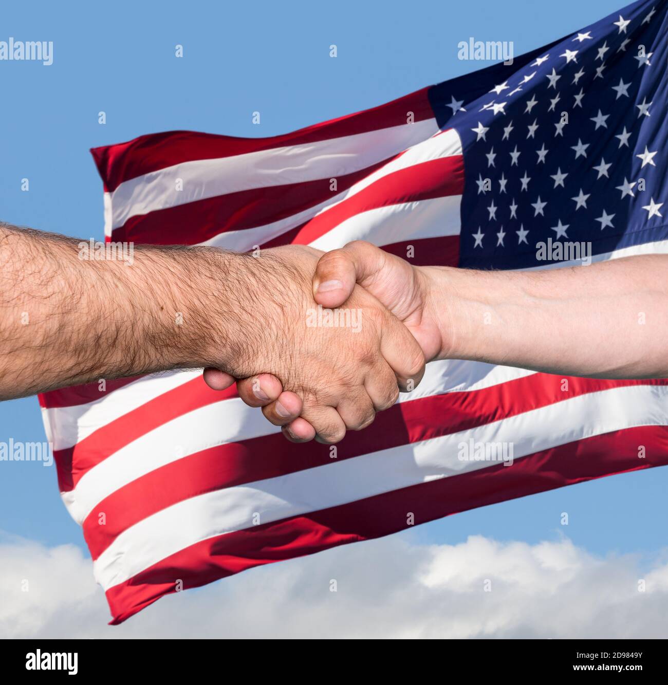 Handshaking. The USA flag and shaking hands of two male people Stock ...