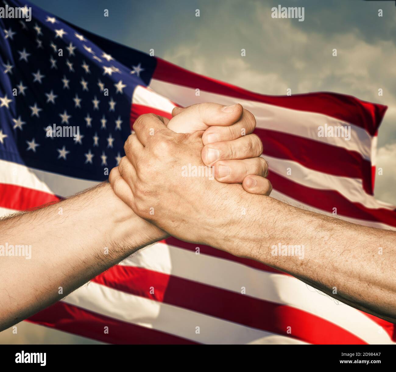 Patriotic concept. Handshaking. The USA flag and shaking hands of two ...