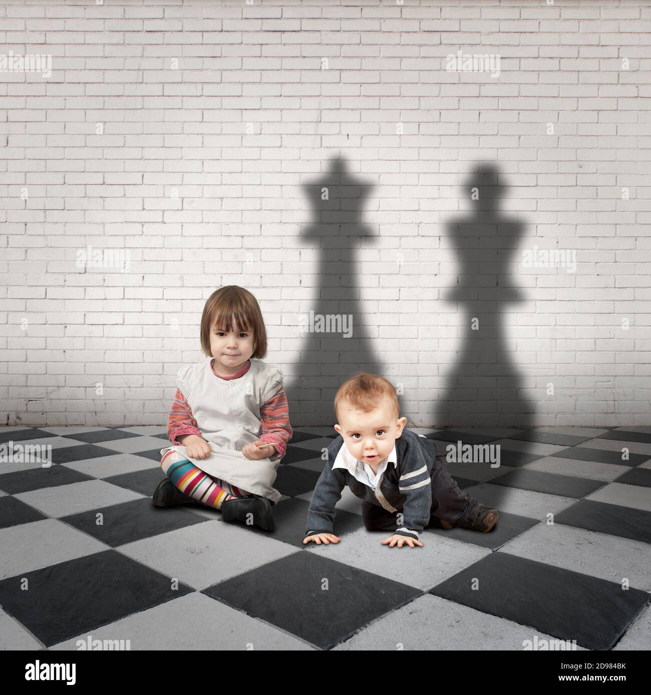 child with king and queen shadows on a checkered floor Stock Photo - Alamy