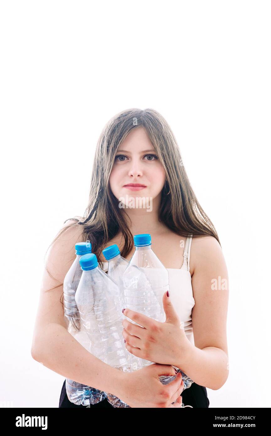 Girl collecting plastic bottles to recycle them Stock Photo - Alamy