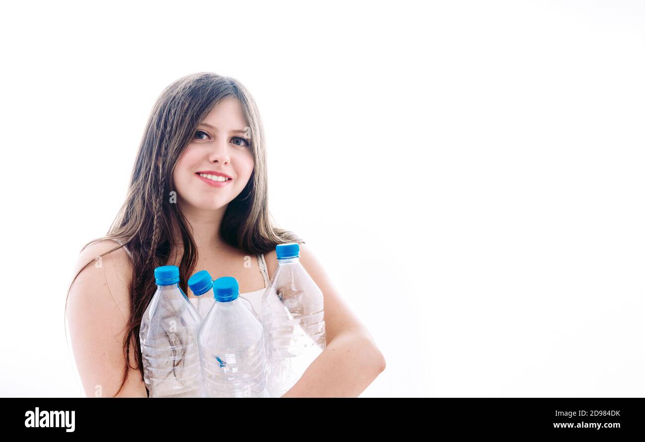 Girl collecting plastic bottles to recycle them Stock Photo - Alamy