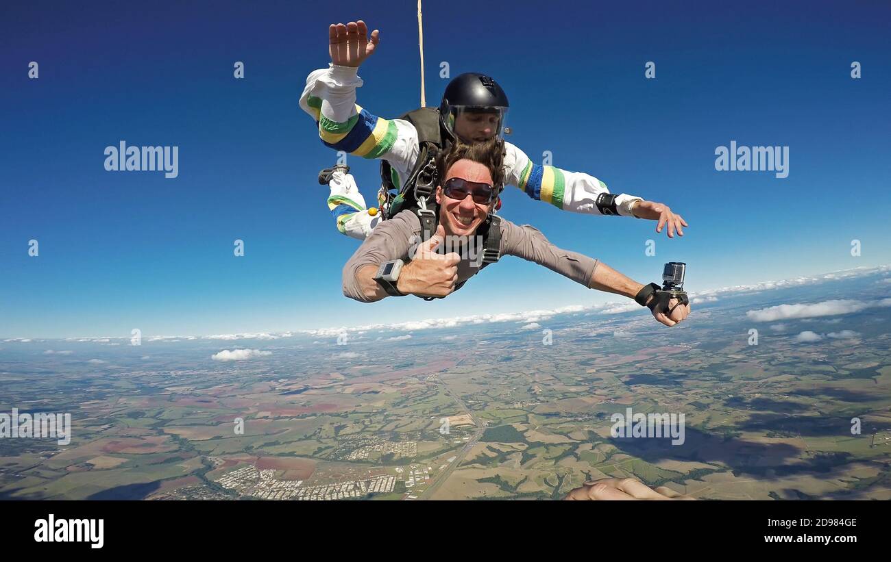 Sky diving tandem friends clear sky Stock Photo - Alamy