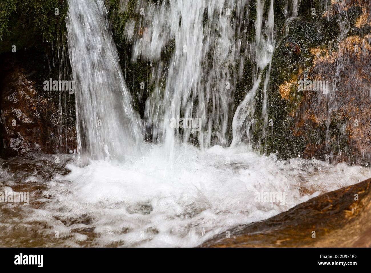 Close-up view of waterfall splashing into pool Stock Photo - Alamy