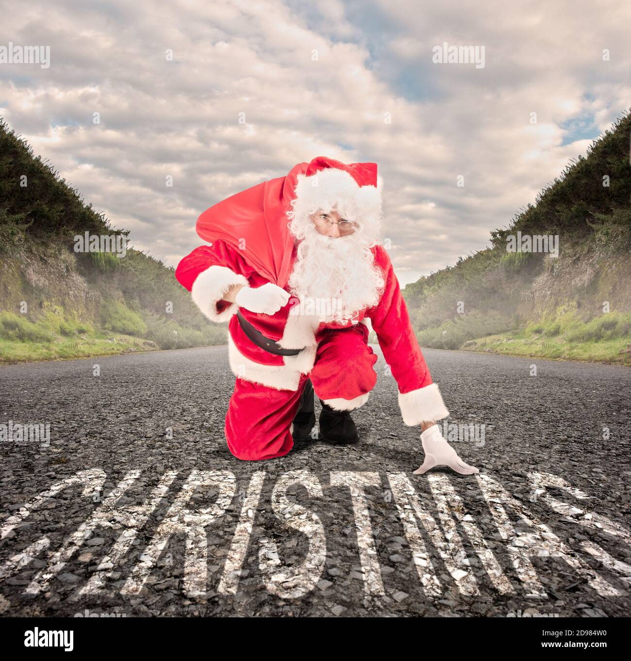 santa claus on a road ready to run. christmas concept Stock Photo - Alamy