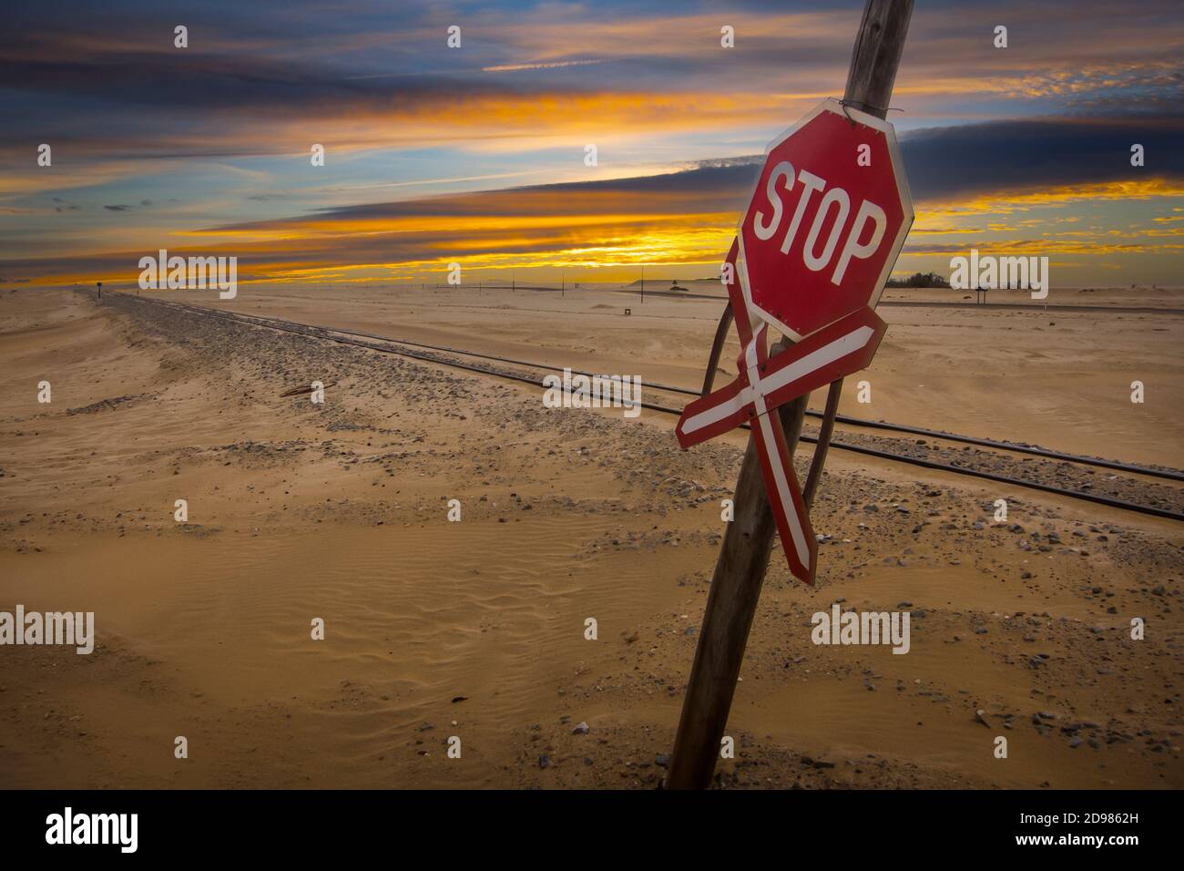 landcape with railway crossing and awesome sunset sky over Namib Desert ...