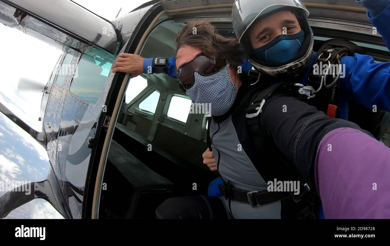 Skydiving tandem with protective mask after the lockdown Stock Photo ...