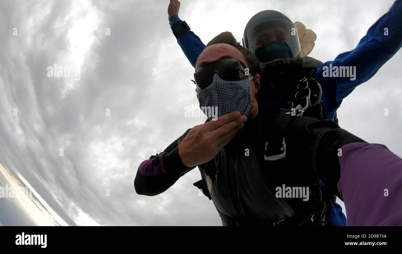 Skydiving tandem with protective mask after the lockdown Stock Photo ...