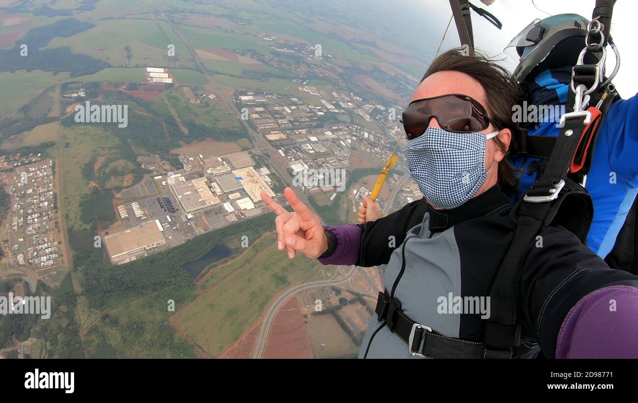 Skydiving tandem with protective mask after the lockdown Stock Photo ...