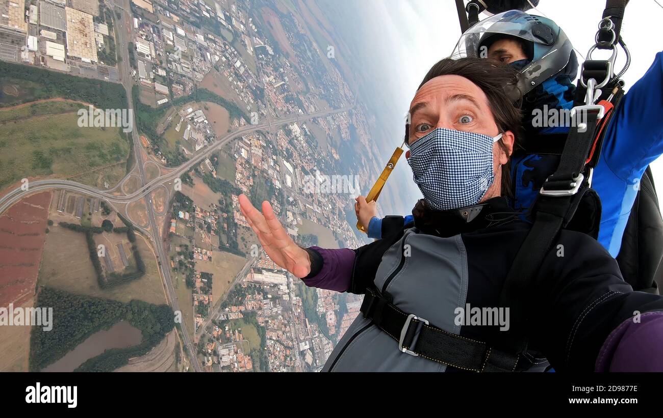 Skydiving tandem with protective mask after the lockdown Stock Photo ...