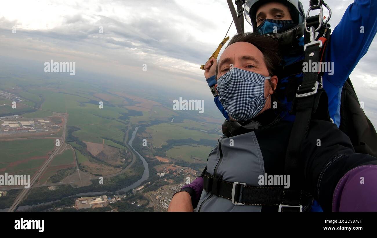 Skydiving tandem with protective mask after the lockdown Stock Photo ...