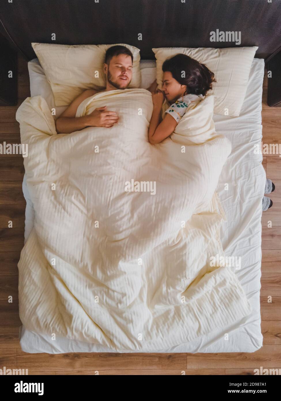 overhead top view of couple in bed Stock Photo - Alamy