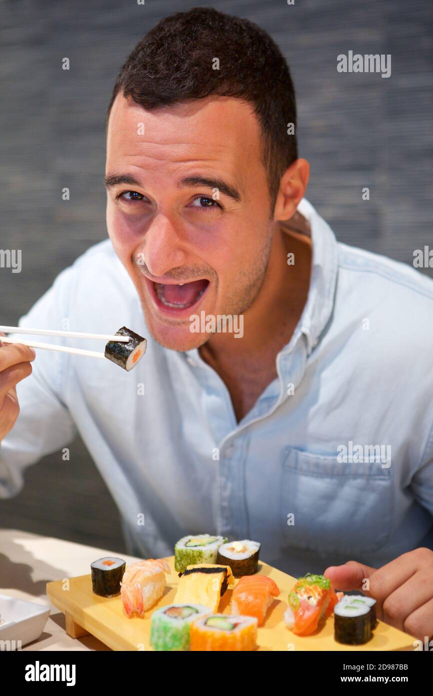 Happy man eating hi-res stock photography and images - Alamy