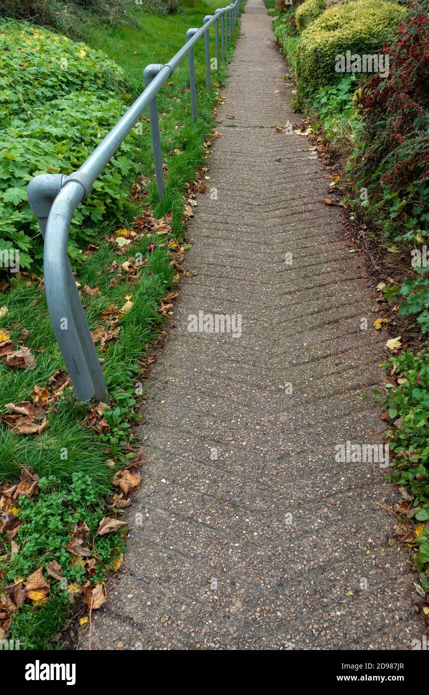 Steep narrow path with handrail and autumn leaves Stock Photo - Alamy