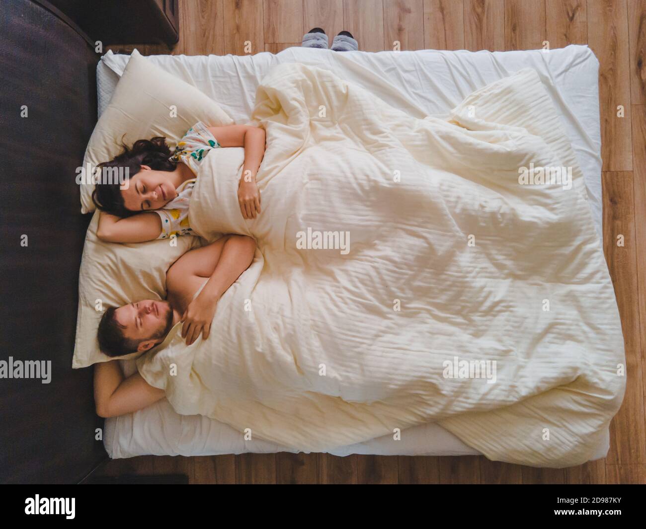 overhead top view of couple in bed Stock Photo - Alamy