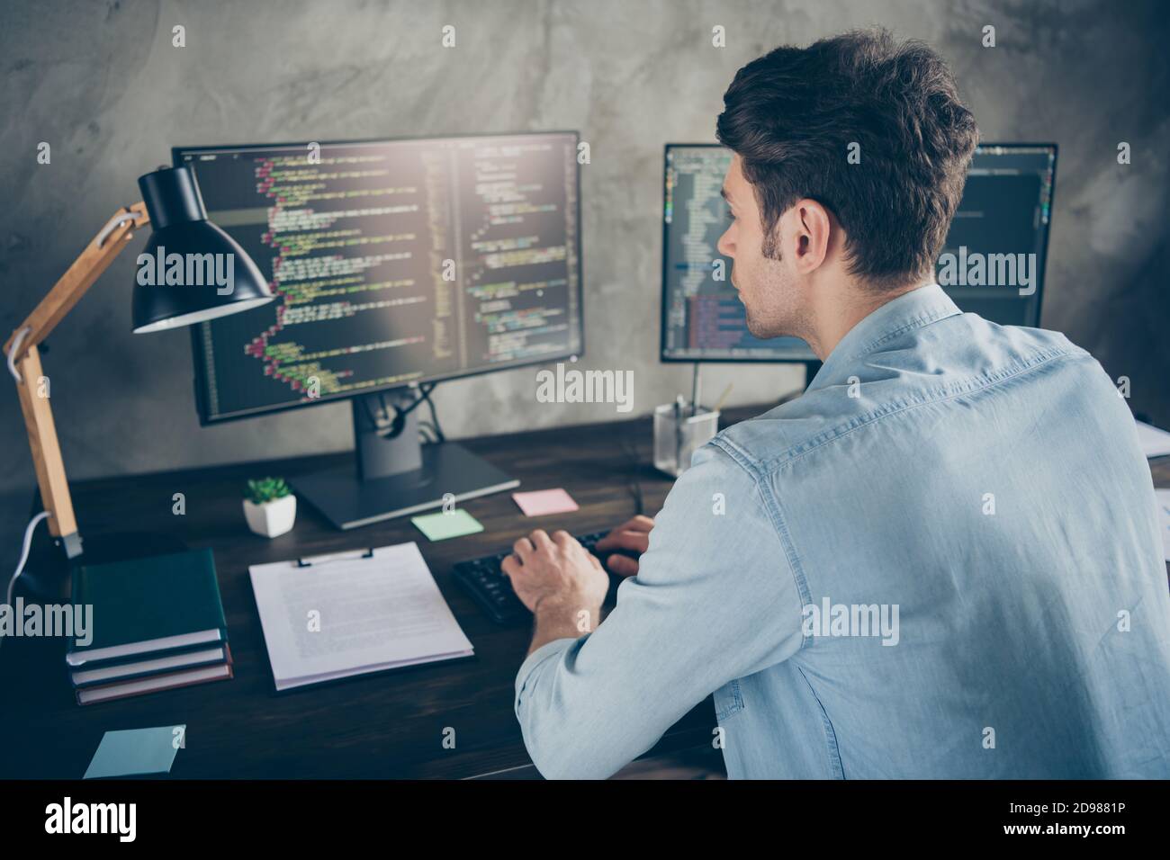 Rear back behind view portrait of his he nice attractive focused geek ...