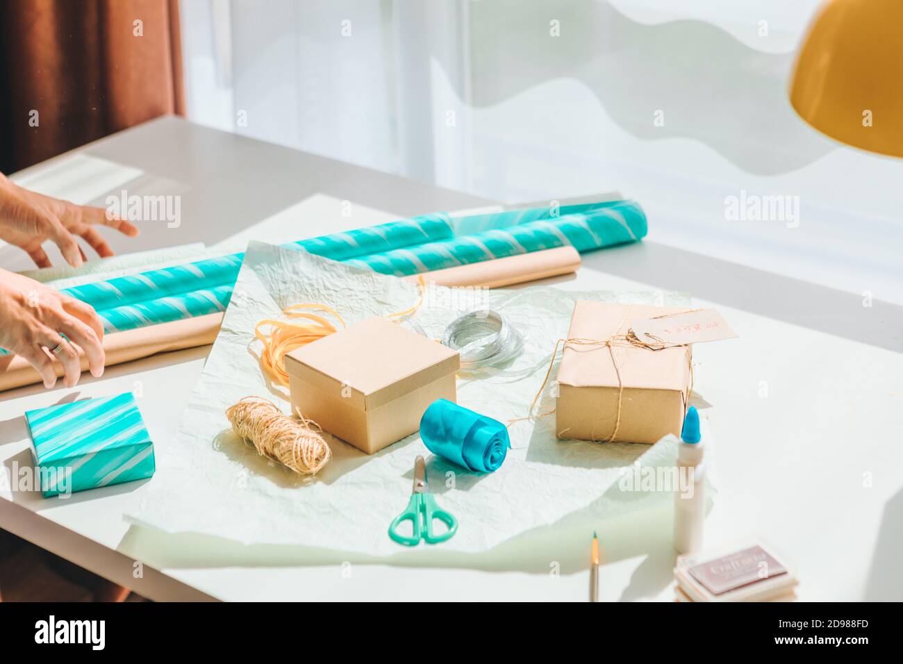 packing gift box with wrapping paper Stock Photo - Alamy