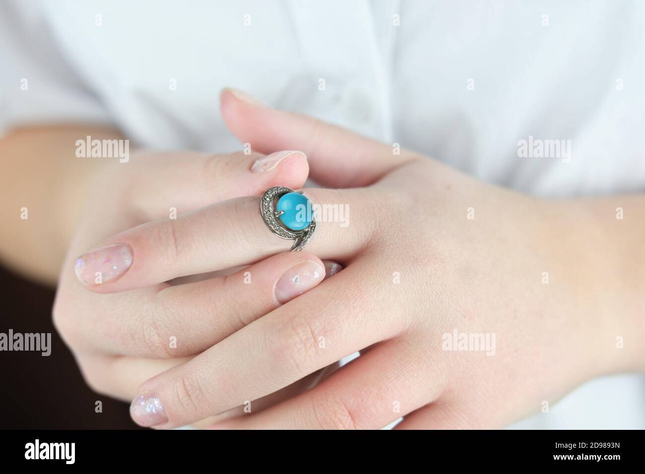 Woman wearing silver ring hi-res stock photography and images - Alamy