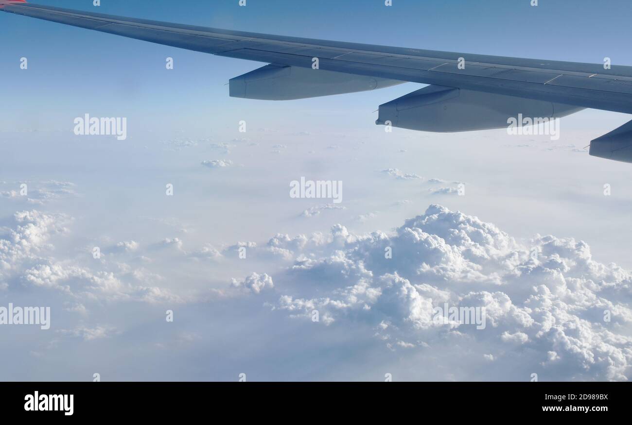 plane wing and cloud floating on sky through window frame Stock Photo ...