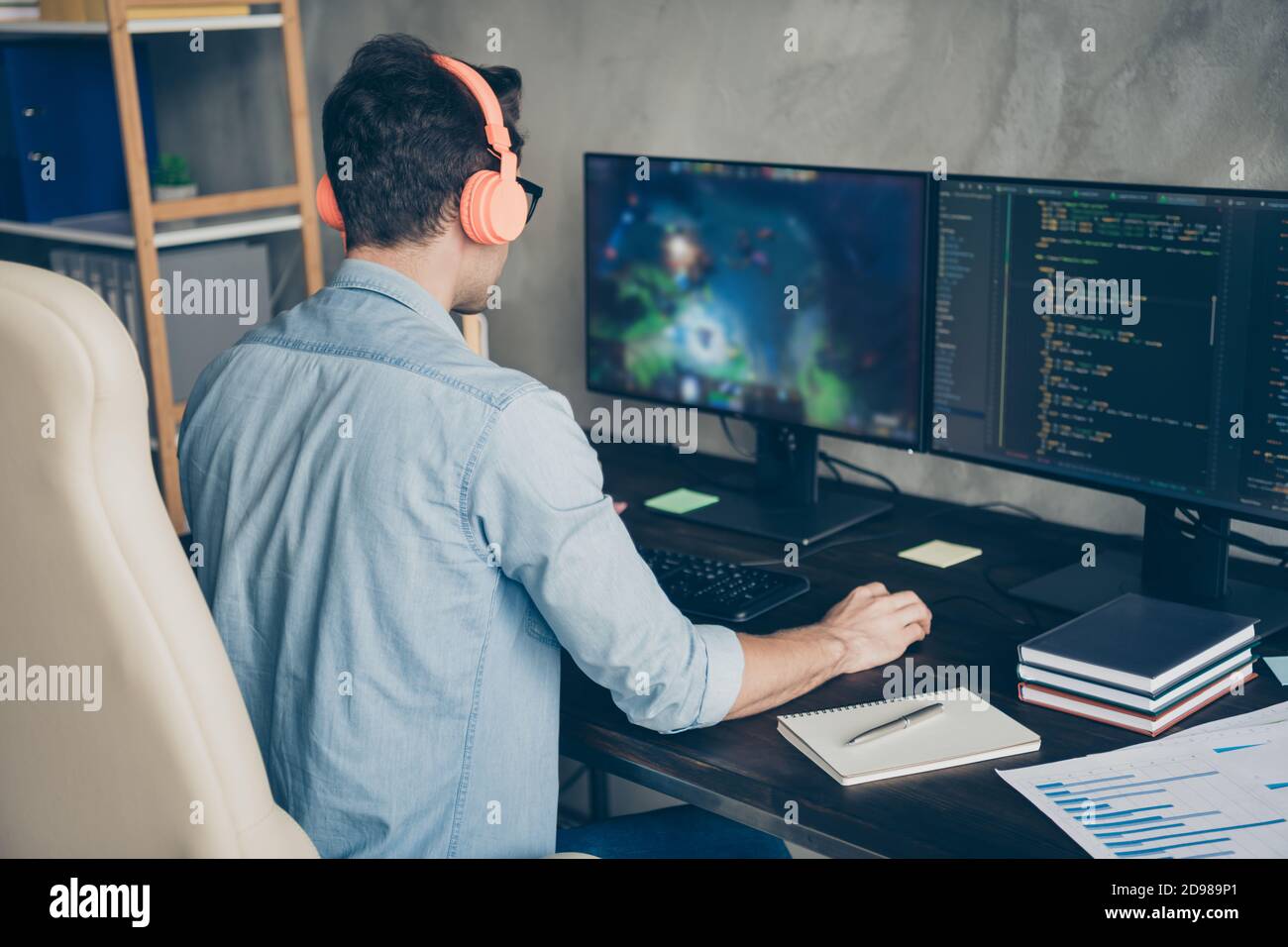 Rear back behind view of his he nice focused skilled experienced guy ...