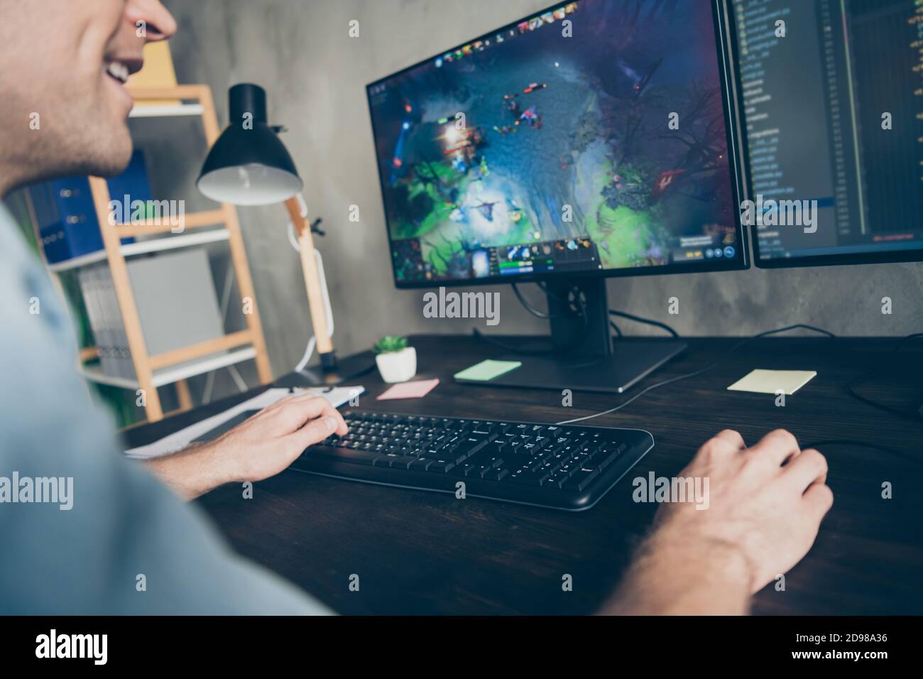 Cropped close up view photo of pc monitor guy play video game sit desk ...