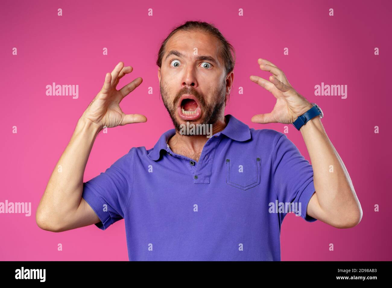 Very angry middle-aged man shouting against pink background Stock Photo ...
