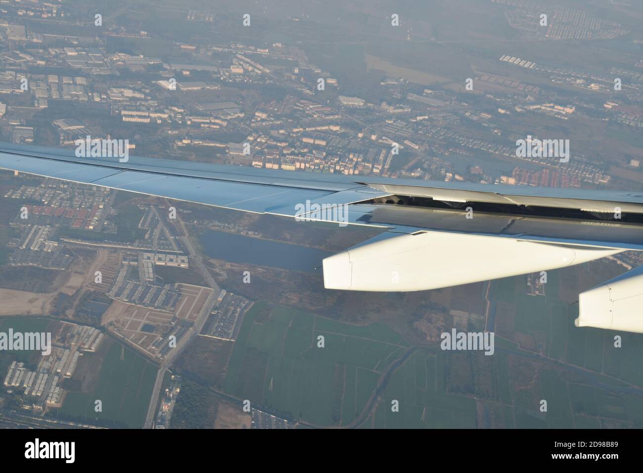 plane wing and cloud floating on sky through window frame Stock Photo ...