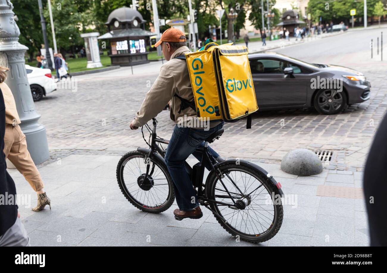 Lviv, Ukraine - May 25, 2020: A Glovo food delivery courier delivers ...