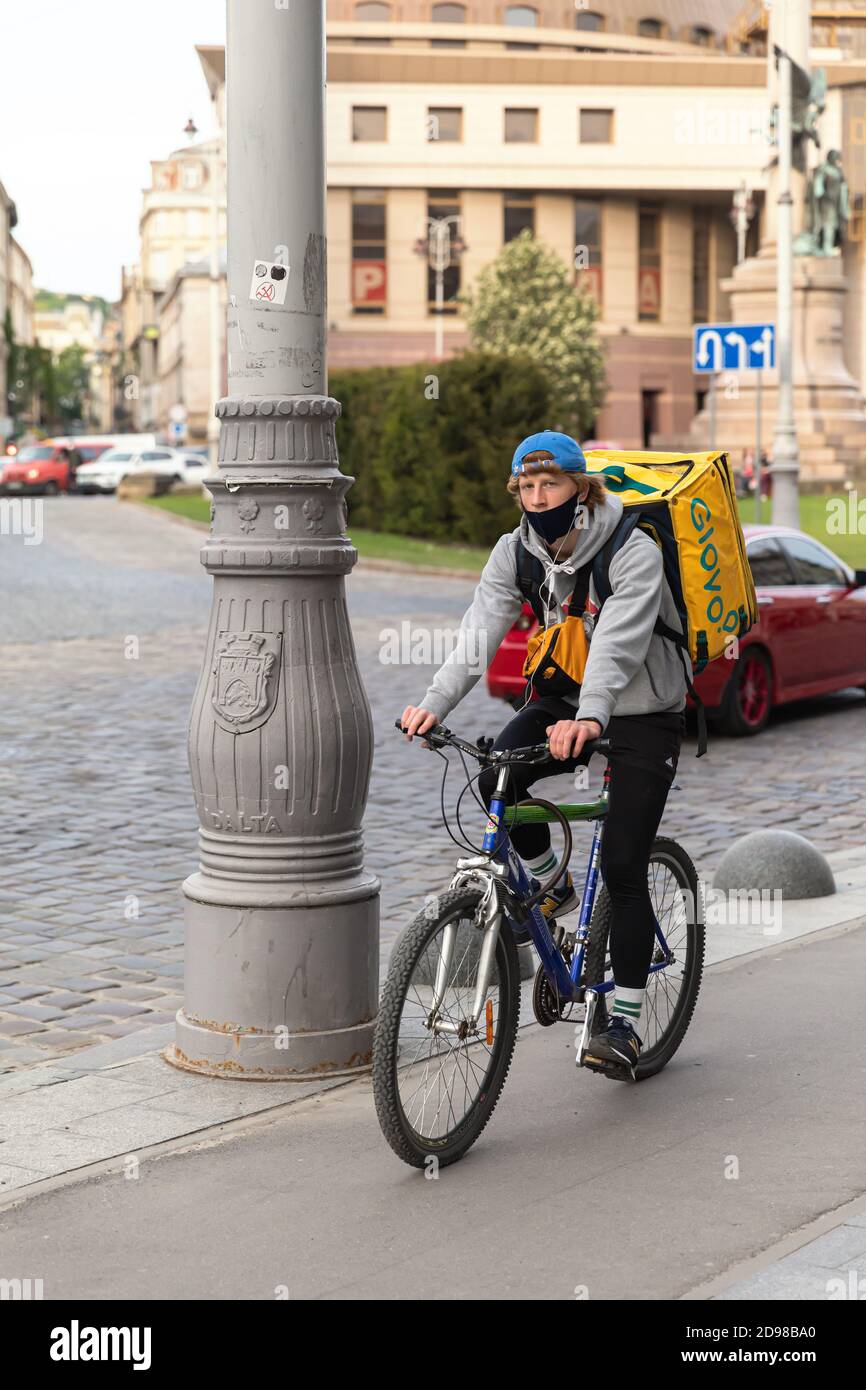 Lviv, Ukraine - May 25, 2020: A Glovo food delivery courier delivers ...