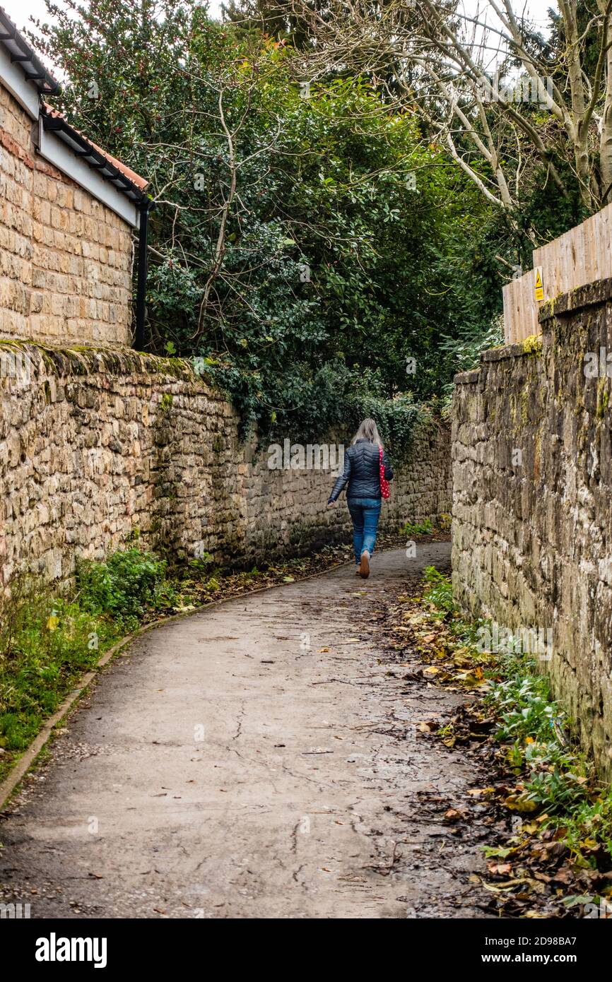 Old lady walking away hi-res stock photography and images - Alamy